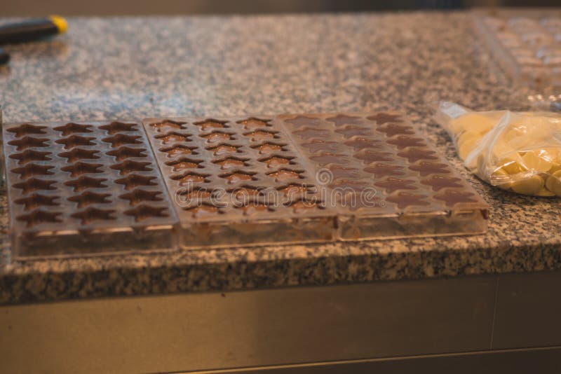 Mold filled with chocolate stock image. Image of industrial - 71621603