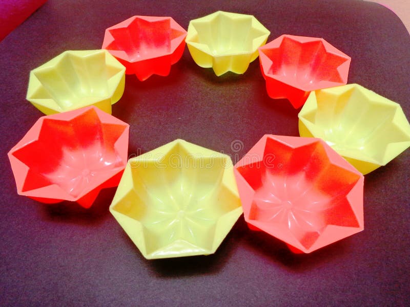 The Mold for Making Pudding is Made of Plastic with Red and Yellow ...