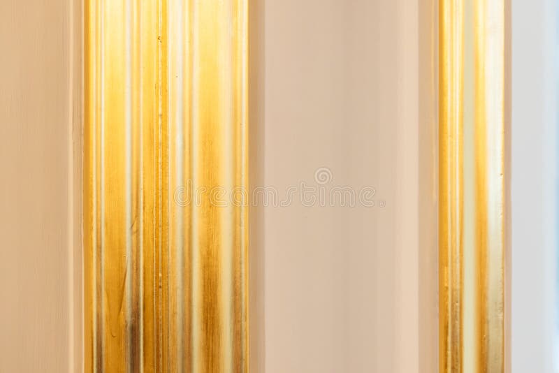 Molded Wall Decoration with Vertical Gold Colored Elements Stock Image ...