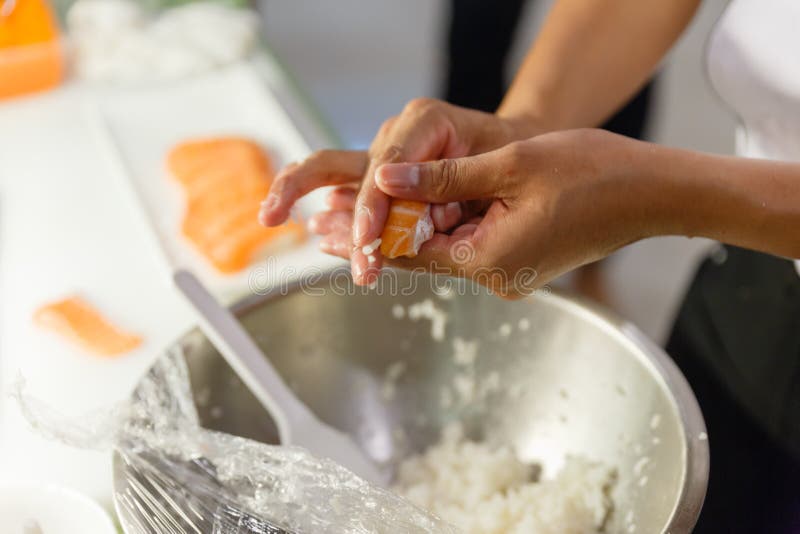 Molding Rice and Salmon for Making Sushi by Chef S Hand Stock Photo ...
