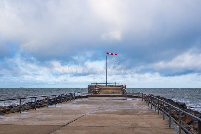 Mole on Shore of the Baltic Sea in Warnemuende, Germany Stock Image ...