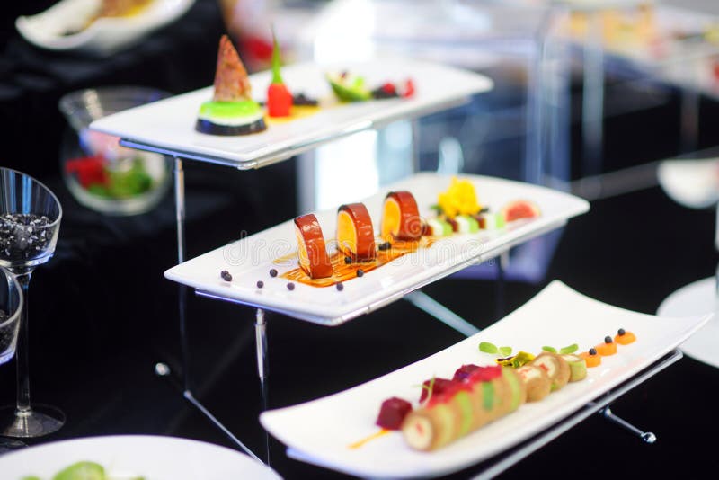 Molecular Modern Cuisine. Various Fancy Dishes on White Plates in a ...