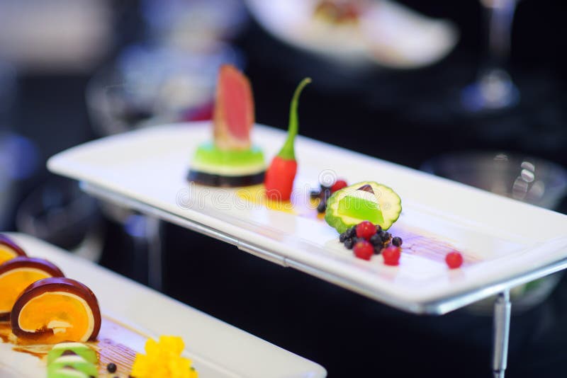 Molecular Modern Cuisine. Various Fancy Dishes on White Plates in a ...