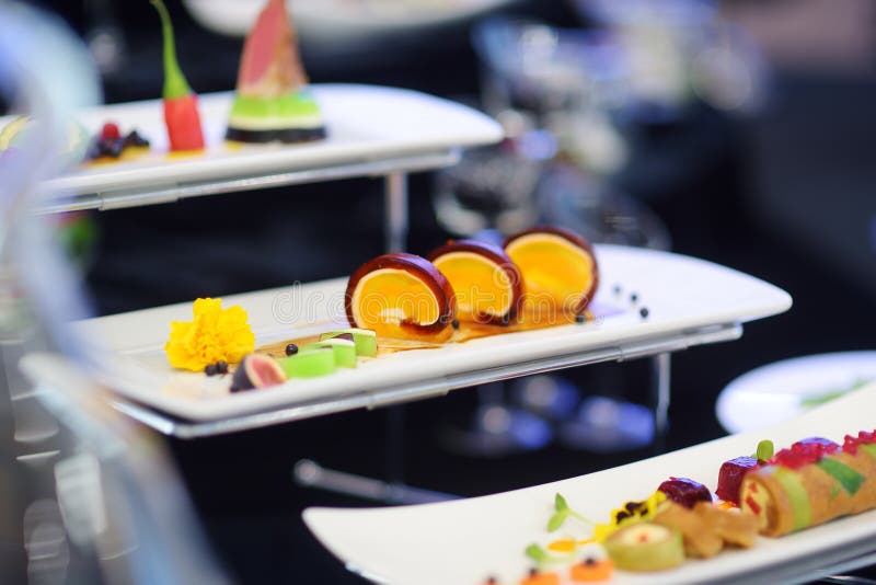 Molecular Modern Cuisine. Various Fancy Dishes on White Plates in a ...