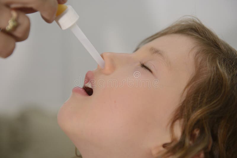 Mom applying nose drops stock photo. Image of fluid, dropper - 33074484