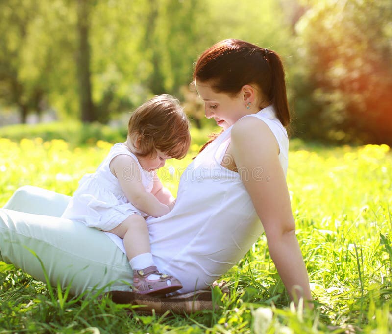 Mom and Baby Having Fun on Grass Stock Image - Image of carefree ...