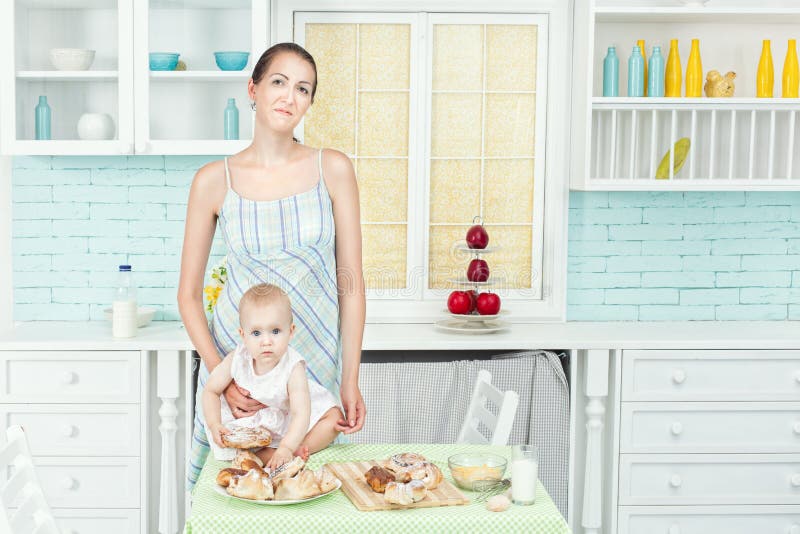 Mom and Baby at the Kitchen Table. Stock Photo - Image of family ...