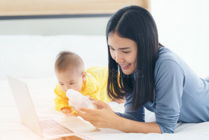 Mom and Baby with Laptop Computer Working from Home Stock Image - Image ...