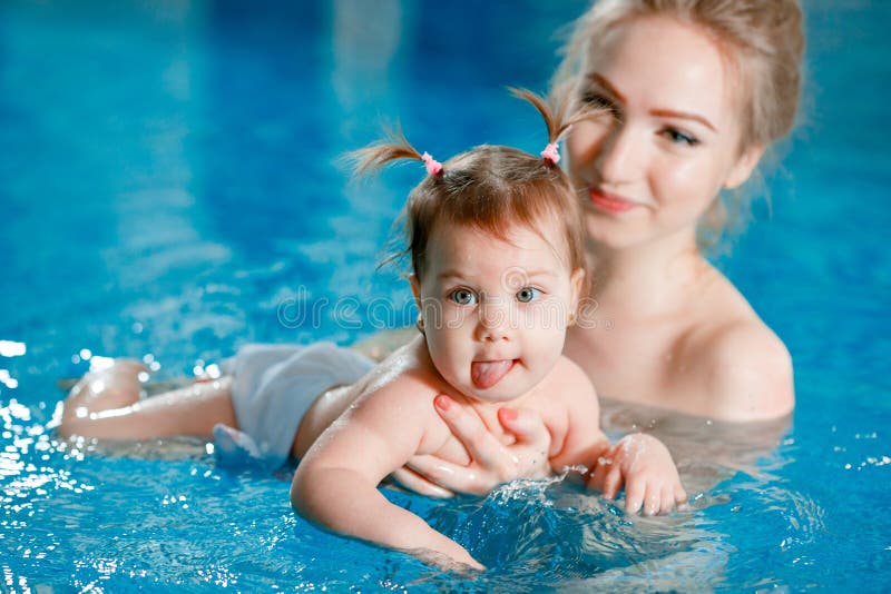 Mom and Baby Swim in the Pool. Stock Photo - Image of lesson, baby ...
