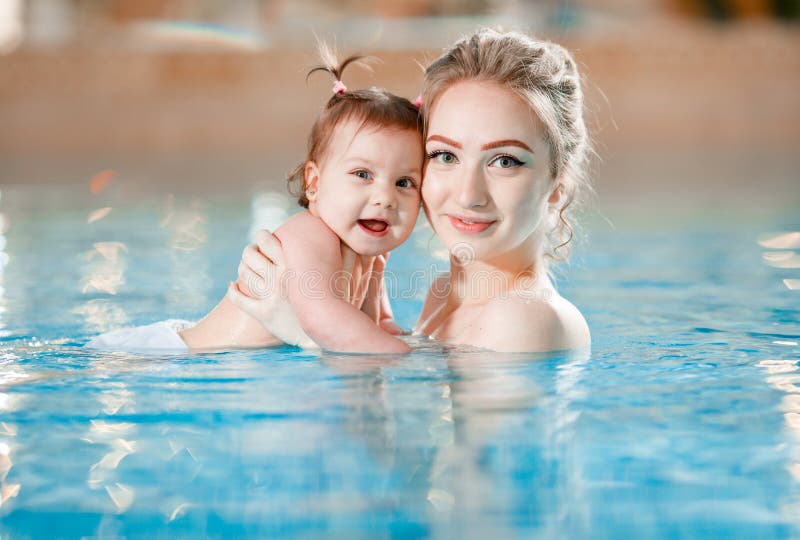 Mom and Baby Swim in the Pool. Stock Photo - Image of baby, childhood ...