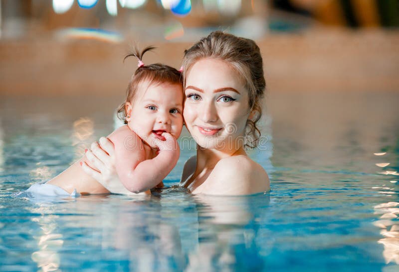 Mom and Baby Swim in the Pool. Stock Photo - Image of person, pool ...