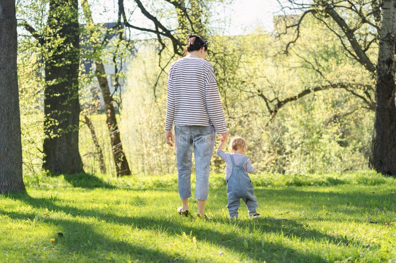 Mom and Baby Walk in the Park in Spring, Baby S First Independent Steps ...