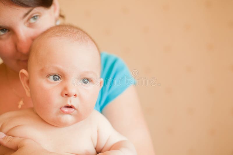 Mom with Chain with Cross Hold Baby Stock Photo - Image of eyes, care ...
