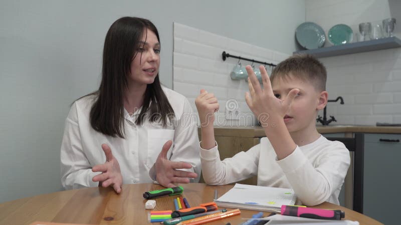 Mom Comes Up with a Math Problem for Her Son Sitting at the Table Child ...