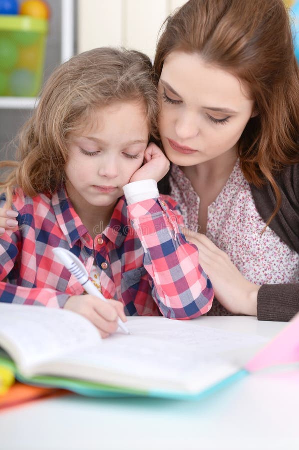 Mom and Daughter Doing Lessons Stock Image - Image of caucasian, people ...