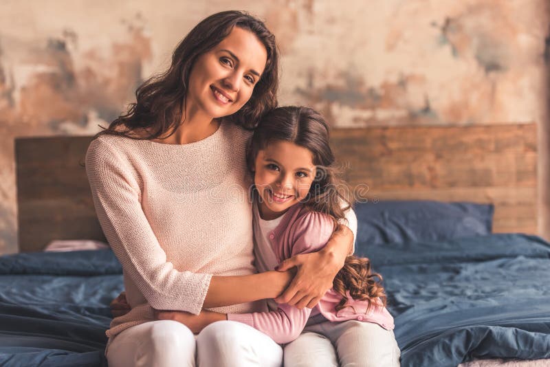 Mom and daughter at home stock image. Image of casual - 104110285