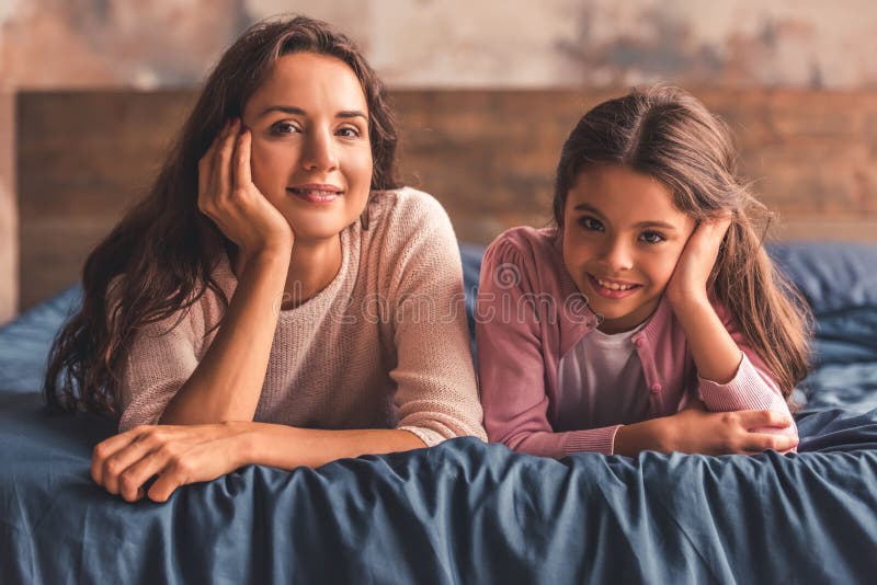 Mom and daughter at home stock image. Image of adorable - 104110587