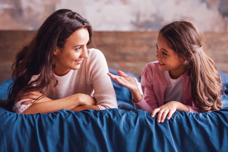 Mom and daughter at home stock image. Image of hair - 310255397