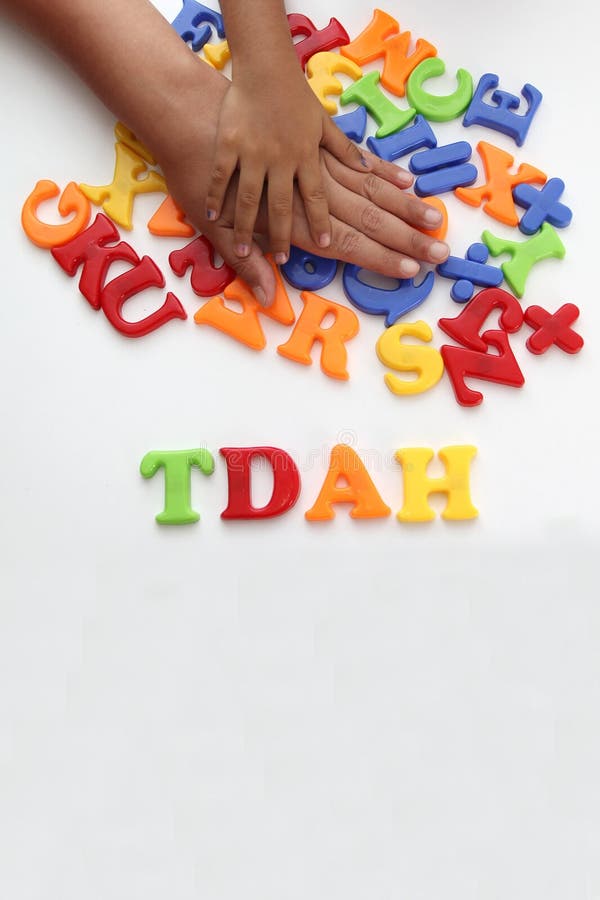 Hands of Mom and Daughter Playing with Colored Letters that Form ADHD ...