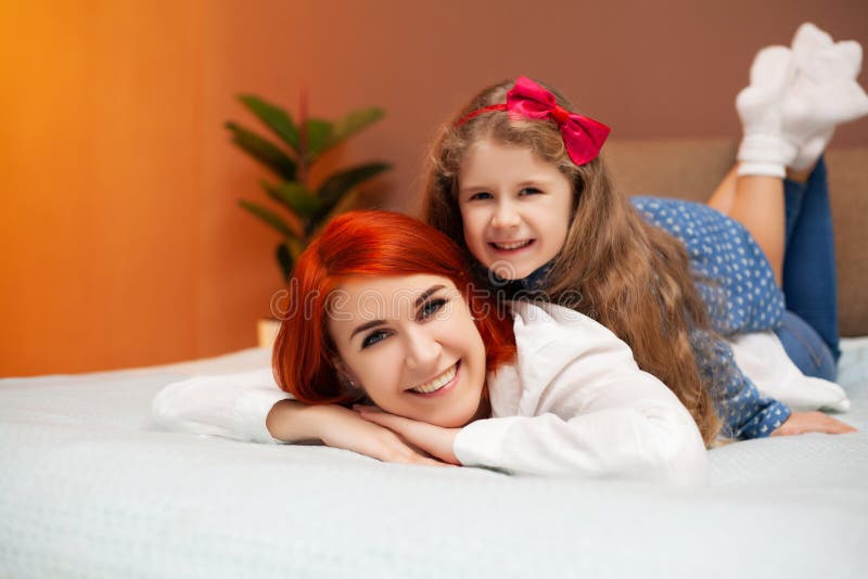 Mom and Daughter Resting in Bed at Home Stock Image - Image of girl ...