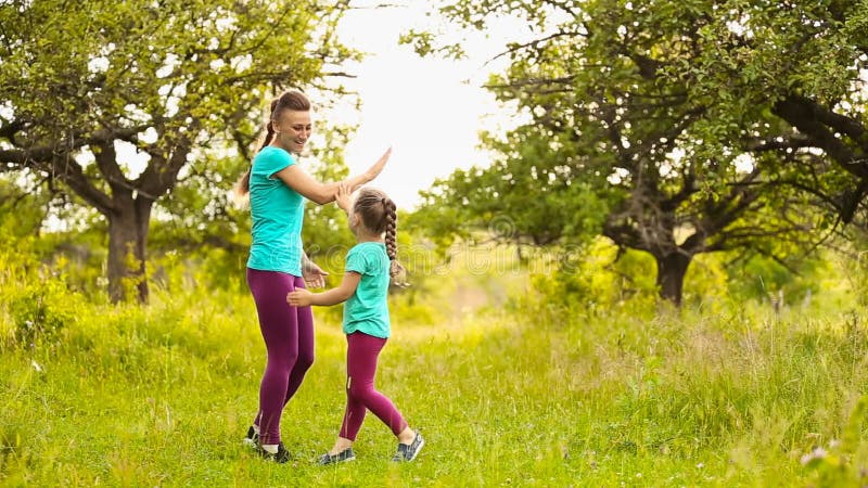 Mom and daughter running stock footage. Video of leisure - 77953850