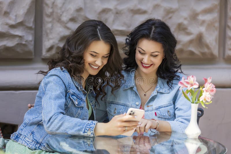 Mom and Daughter Sit at the Table Stock Image - Image of outside ...