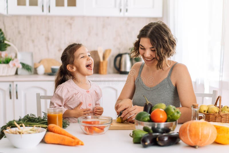 Mom and Daughter Smile and Cook Together Stock Photo - Image of smile ...