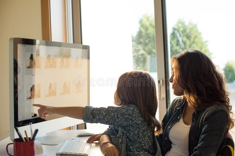 Mom and Daughter Using Computer Stock Photo - Image of photoshoot ...