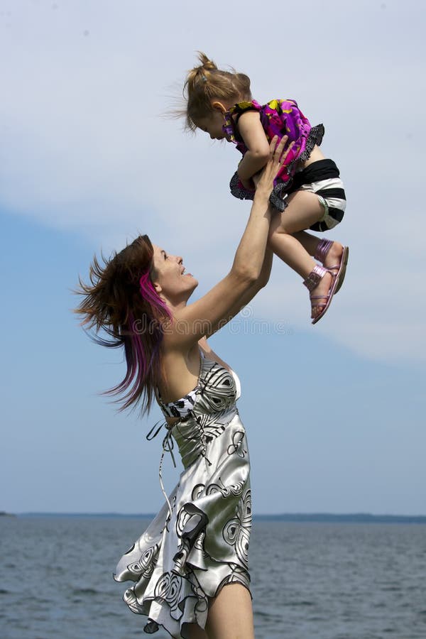 Mom and Daughter by the Water Stock Image - Image of caucasian, beauty ...