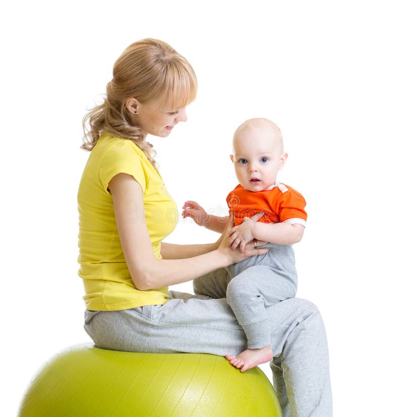 Mom Doing Exercises on a Fit Ball with Baby. Stock Photo - Image of ...