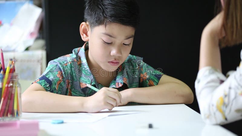 Mom is Force Her Son To Do Homework of the School Stock Footage - Video ...