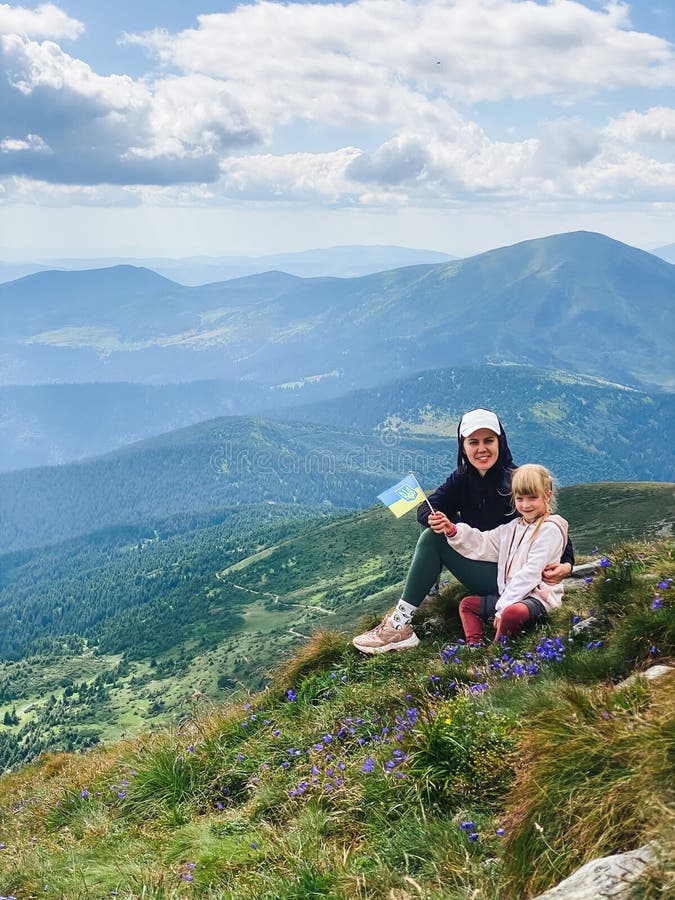 Mom and Girl Hiking on a Mountain Stock Photo - Image of girl, sunlight ...