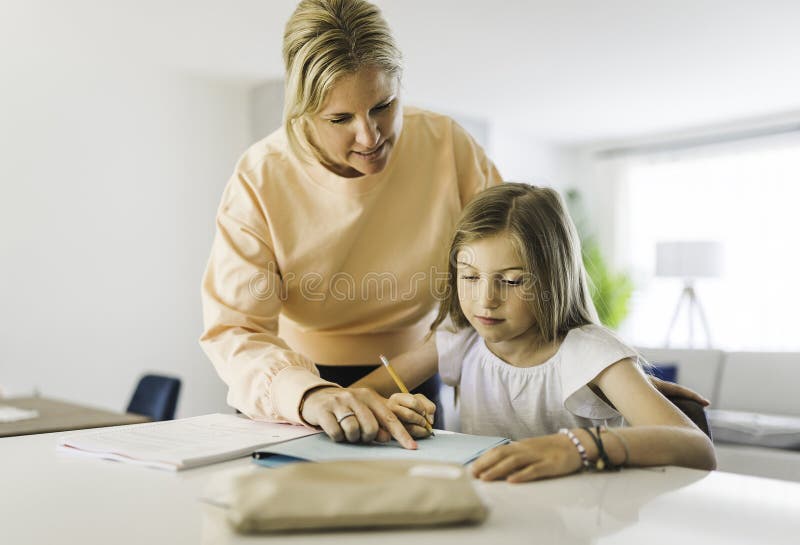 Mom Helping Kid with Homework at Home Stock Photo - Image of mother ...