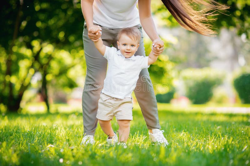 Mom Helps Little Baby Son Make First Step Move Stock Image - Image of ...