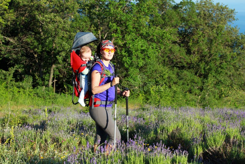 Mom and Her Child in the Backpack. Stock Image - Image of little, carry ...