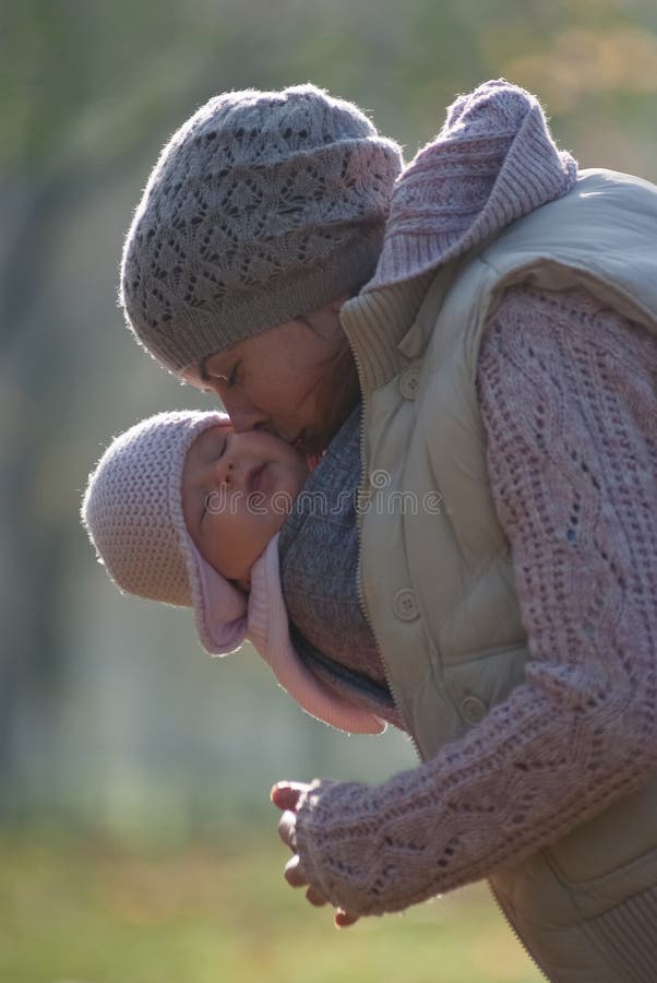 Mom hugging baby outdoors stock photo. Image of cute - 58991574