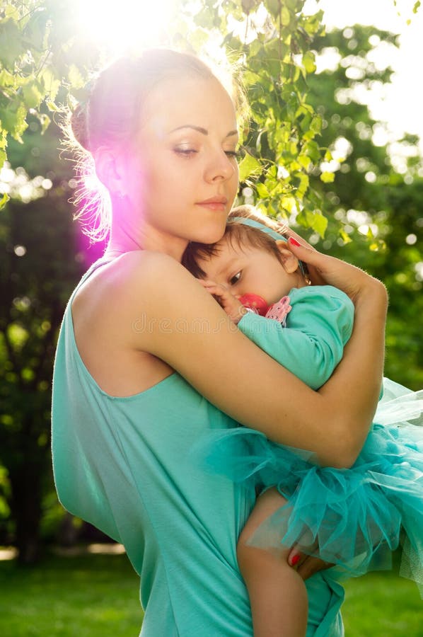 Beautiful mom hugs baby stock photo. Image of childhood - 33183064