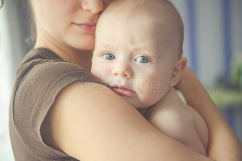 Mom hugs a newborn baby stock photo. Image of bald, cute - 123827554