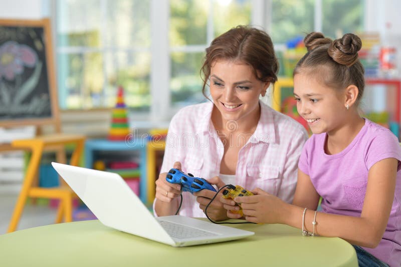 Mom and Kid Have Fun Playing with a Laptop Stock Photo - Image of ...