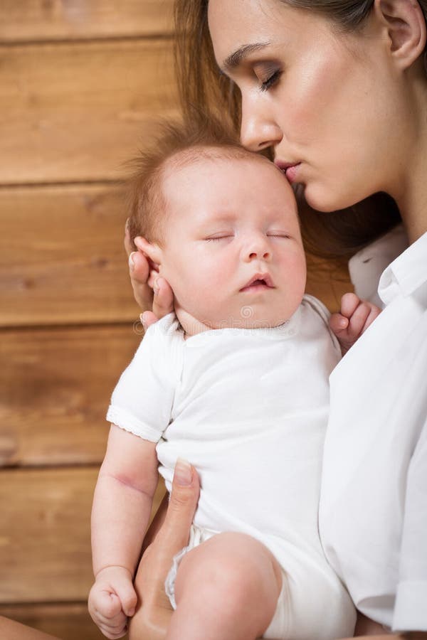 Mom with a newborn baby stock photo. Image of baby, motherhood - 97933870