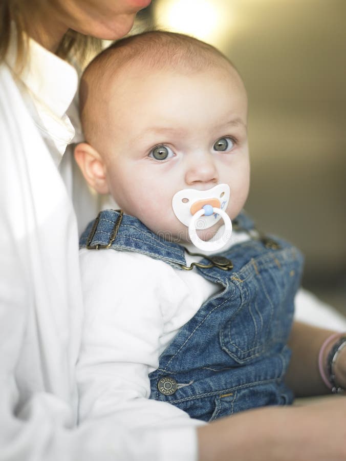 Mom with Pacifier in Mother S Lap Stock Photo - Image of love, closeup ...