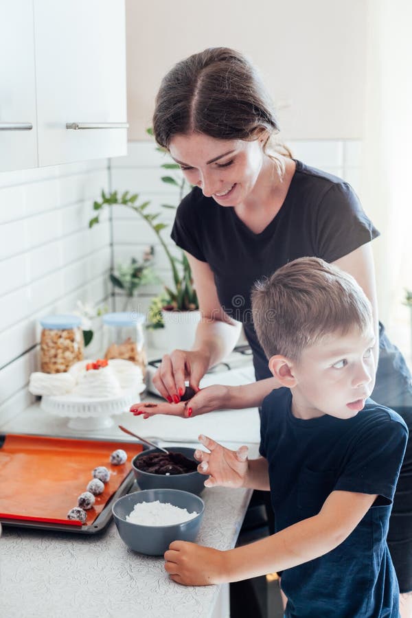 Mom Pastry Chef and Son Cook Sweet Cakes in the Kitchen Stock Image ...