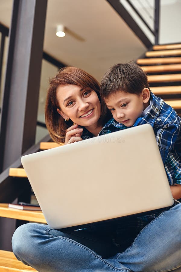 Mom and Son are Doing Homework on the Computer. Concept Mom and ...