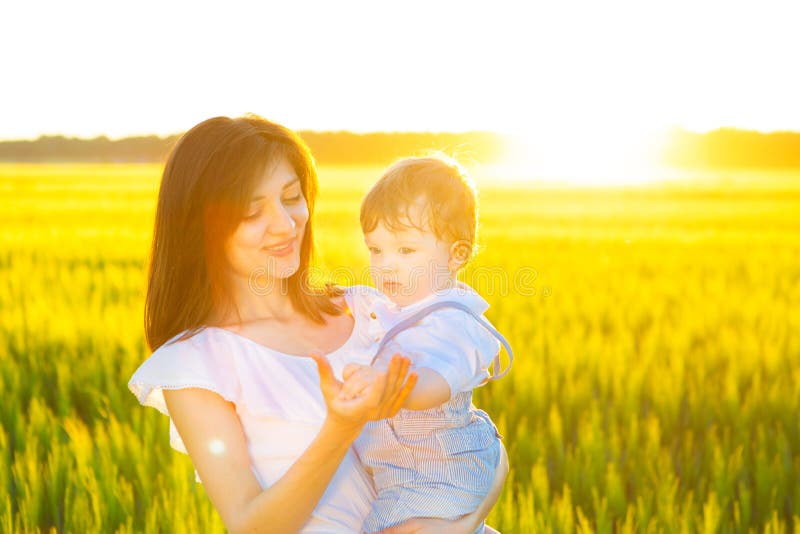 Mom and Son Having Fun by Field Outdoors Enjoying Nature Stock Photo ...