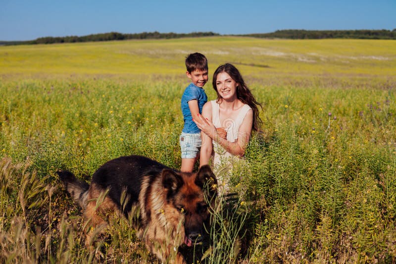Mom and Son Walk with German Shepherd Stock Photo - Image of summer ...