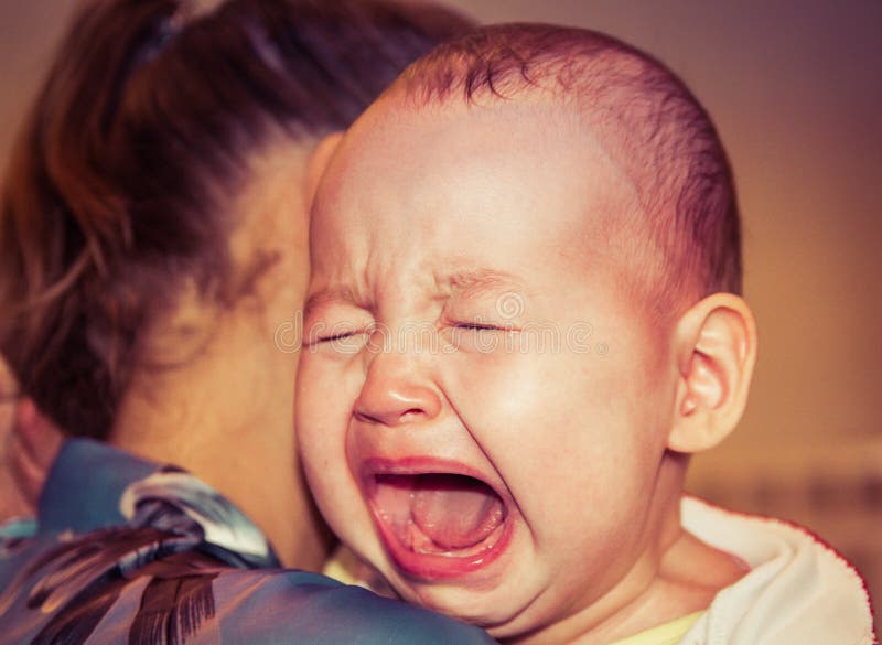 Mom Soothes Baby. the Baby is Crying Stock Photo - Image of mother ...
