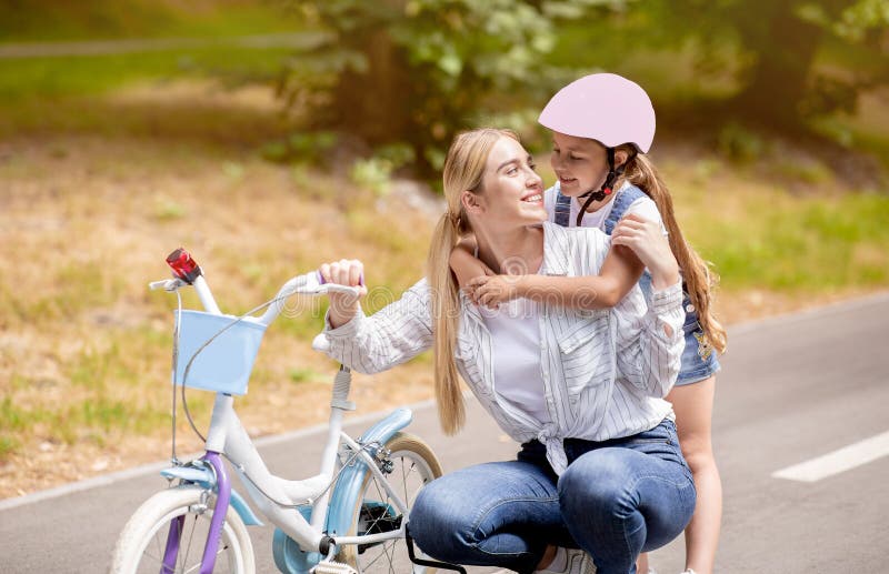 Mom Teaching Her Little Daughter To Ride Bicycle Outdoors Stock Image ... Mom Teaching Her Little Daughter To Ride Bicycle Outdoors Stock Image ...