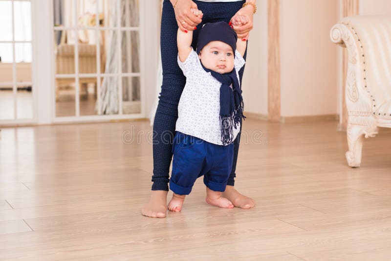 Mom Teaching Her Son`s First Baby Steps Indoors Stock Photo - Image of ...