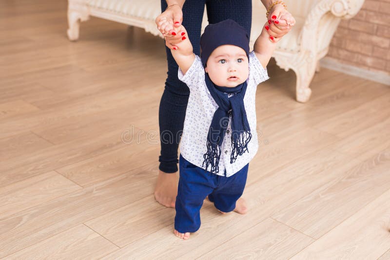 Mom Teaching Her Son`s First Baby Steps Indoors Stock Image - Image of ...