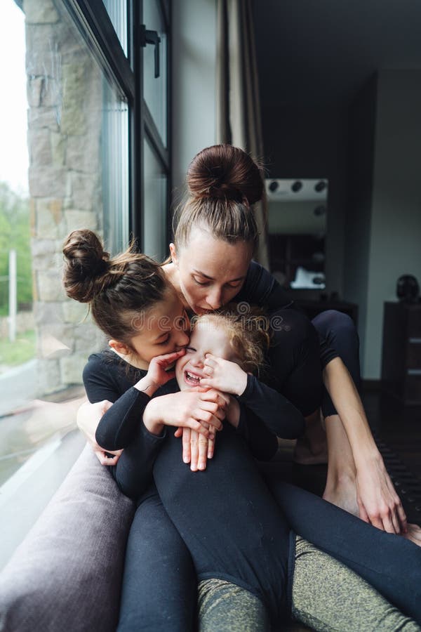 Mom and Two Daughters Together at the Window Stock Image - Image of ...